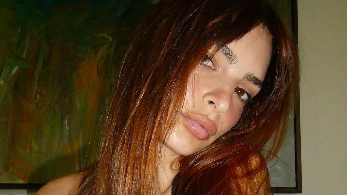 Emily Ratajkowski Poses Topless With Bulky Neck Piece | The Nerd Stash