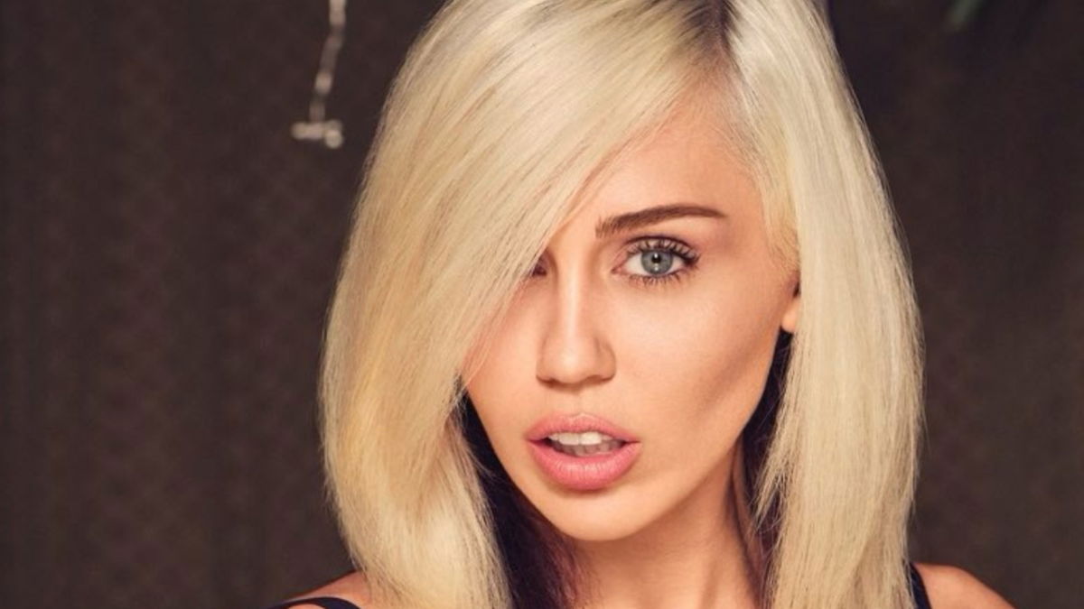 Miley Cyrus Reveals New Job In See-Through Dress Miley Cyrus Reveals New Job In See-Through Dress